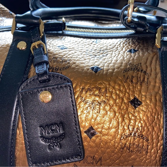 MCM | Bags | Mcm Gold And Black Duffel Bag With Signature Monogram ...